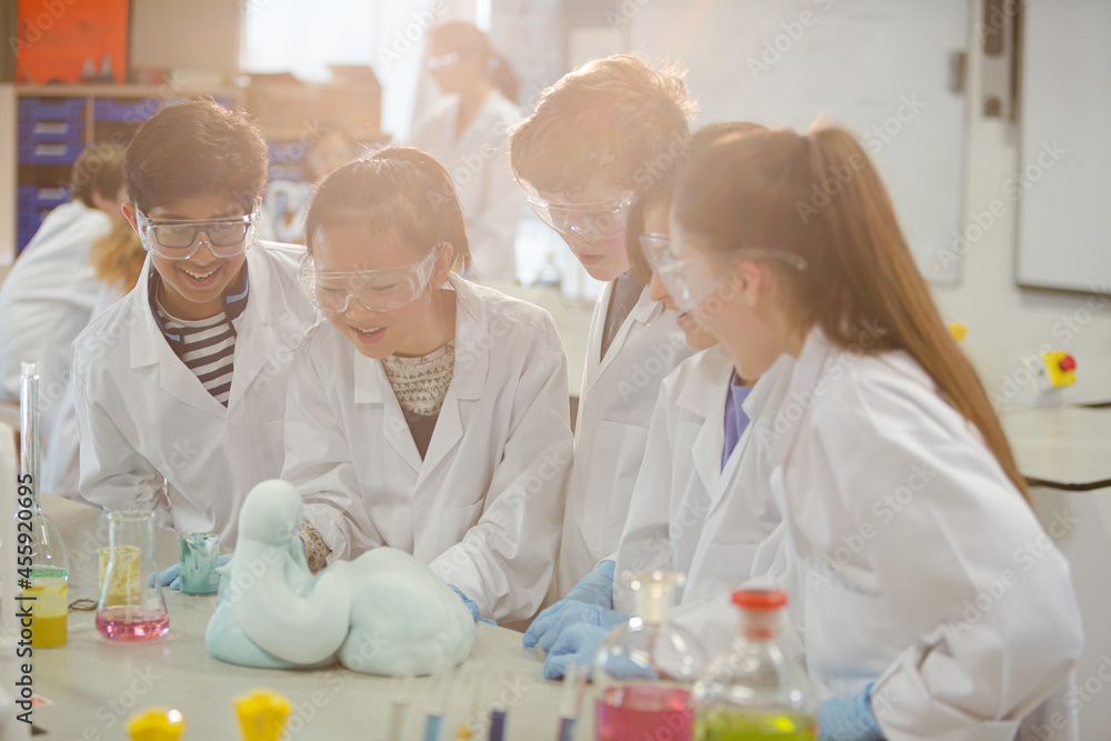 Surprised students conducting scientific experiment, watching chemical ...