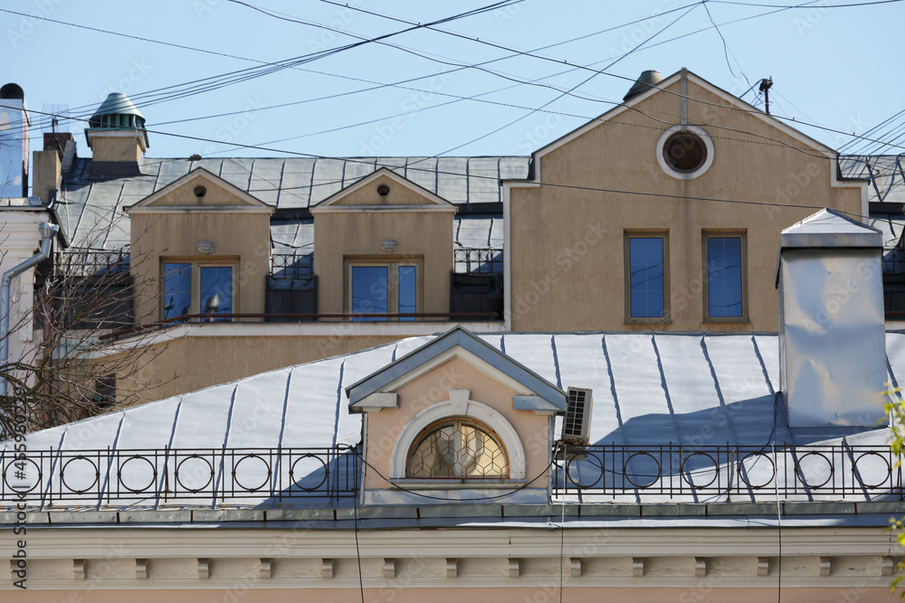 Old street facades and roofs of houses. Arch window. Moscow residential ...