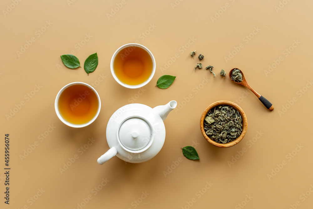 Foto de Two cups of tea with white teapot, top view do Stock | Adobe Stock