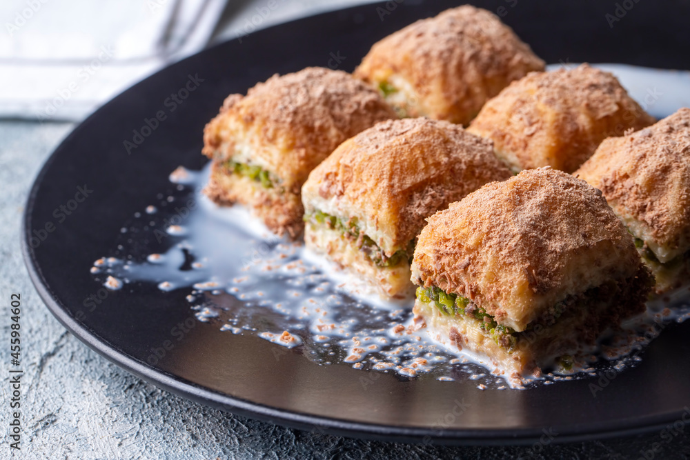 Traditional turkish new dessert cold milky baklava with pistachio ...