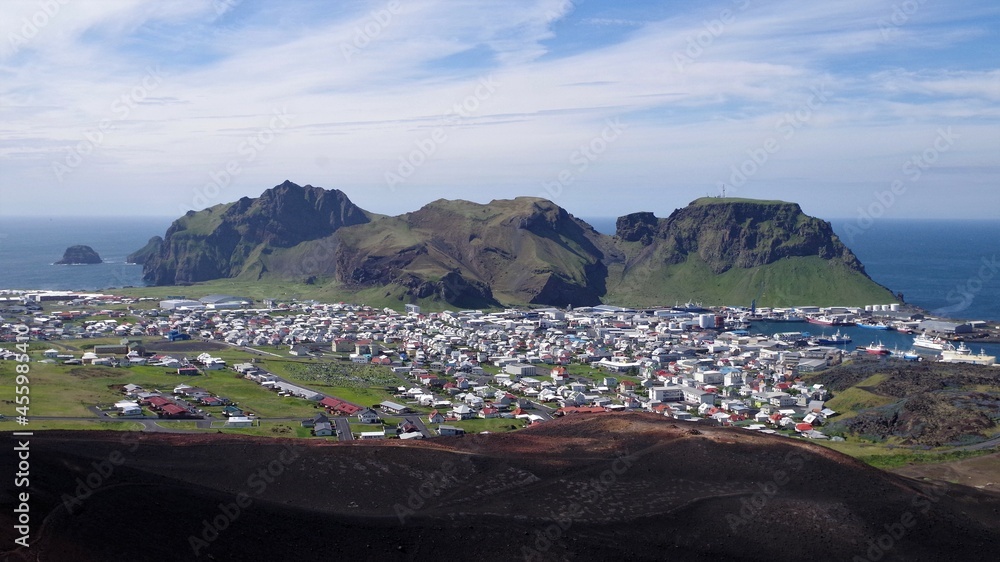 View over the town of Heimaey from neighboring volcano, Eldfell. The ...