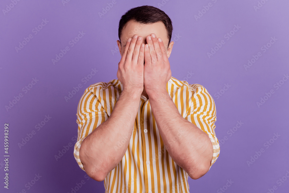 Portrait of desperate crying guy hands hide face wear casual clothes on ...
