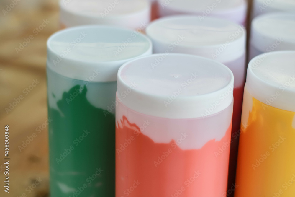 Varieties of colors in white bottles. Stock-Foto | Adobe Stock