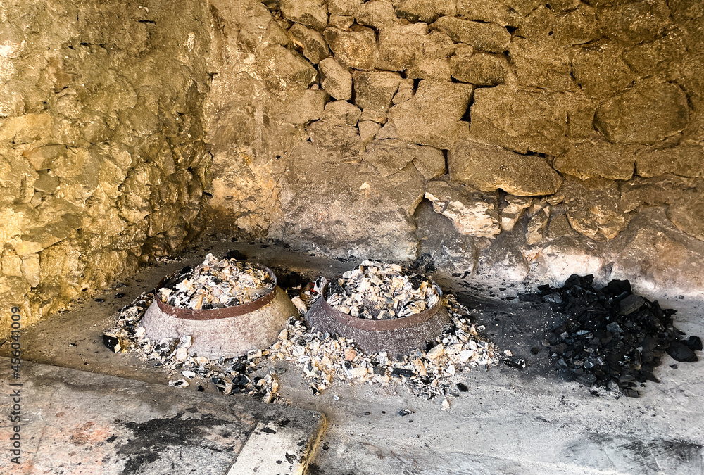 Cooking peka - a traditional Croatian way to roast food under a metal ...