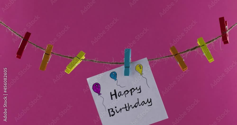 Sticker with the inscription on white paper Happy birthday on a rope on ...