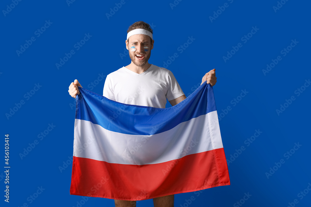 Sport fan with flag on color background Stock Photo | Adobe Stock