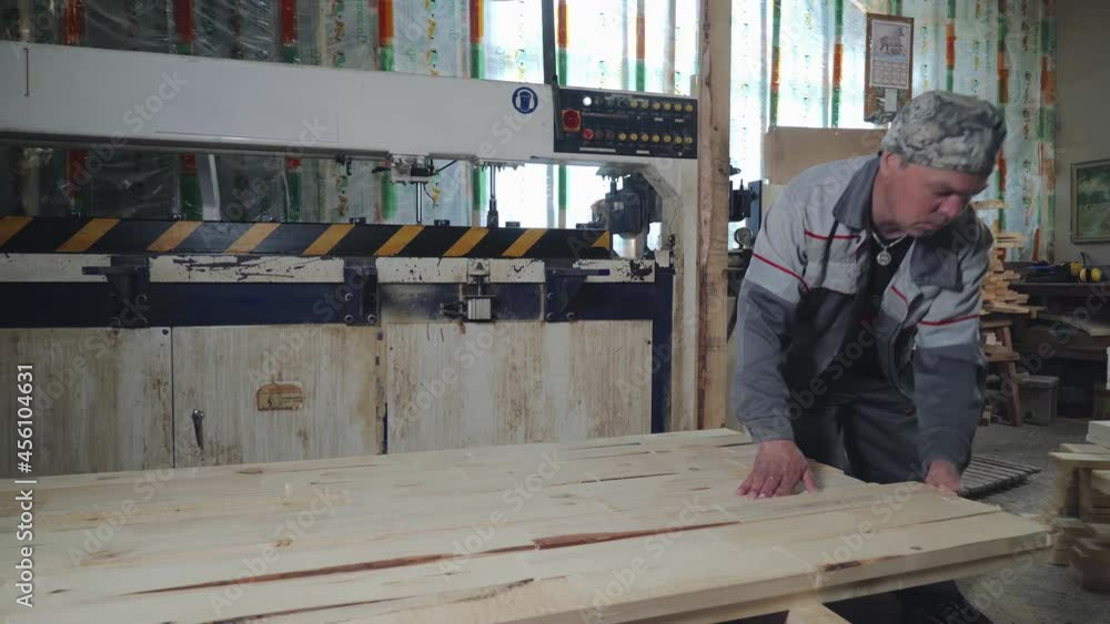 Worker Man Taking Wood Boards From Industrial Lumber Mill And Stacking ...