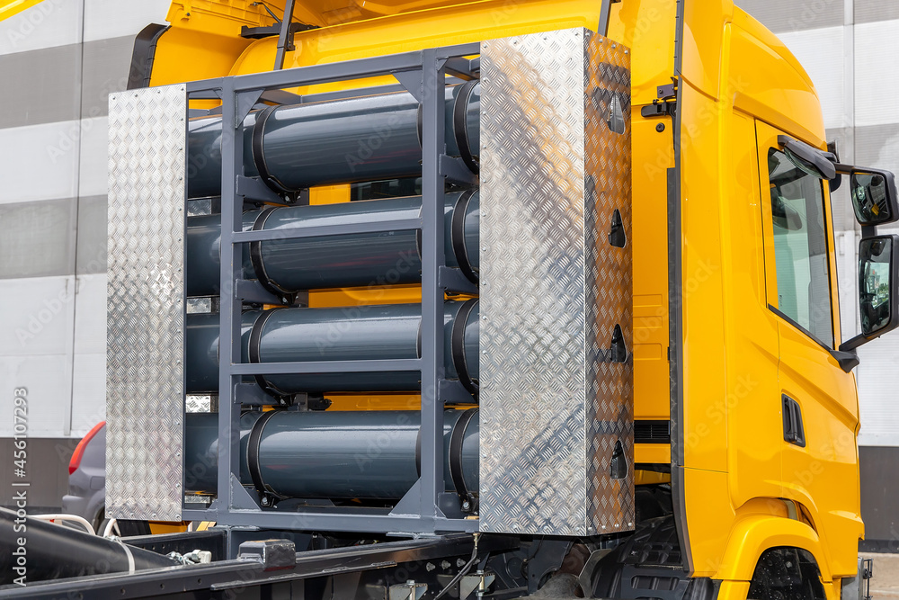 Compressed natural gas cylinders behind the truck cab. Truck with a ...