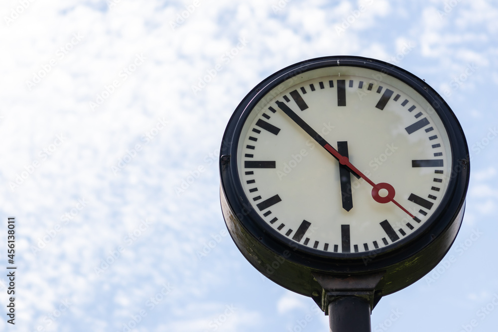 Classic black and white analog clock with correct time shows teamwork ...