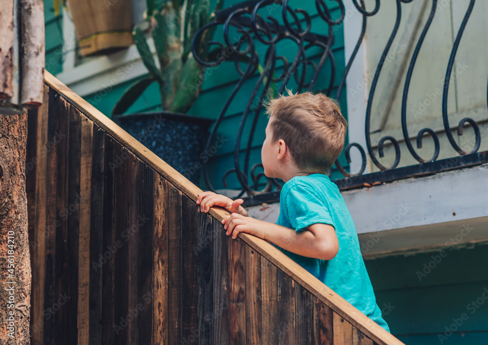 Copy Space lifestyle little boy go move climb wood stairs up outside ...