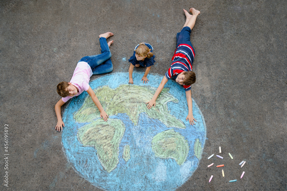 Little preschool girl and two school kids boys with earth globe ...