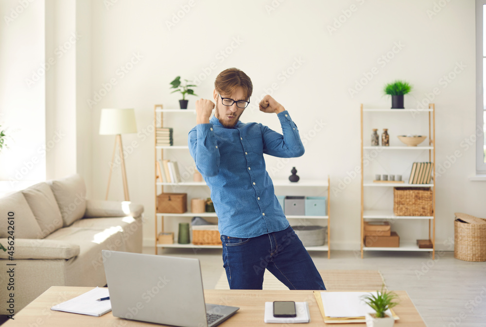 Happy excited euphoric business man or student with laptop celebrating ...