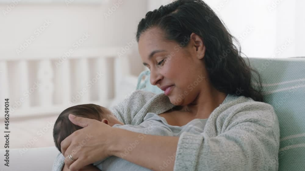 mother breastfeeding baby at home mom nursing infant nurturing child suckling milk from breast ...