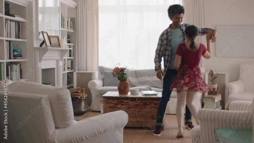 happy father and daughter dancing at home teenage girl having fun dance ...