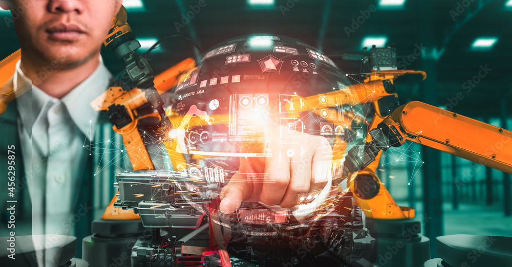 Mechanized industry robot arm and factory worker double exposure ...