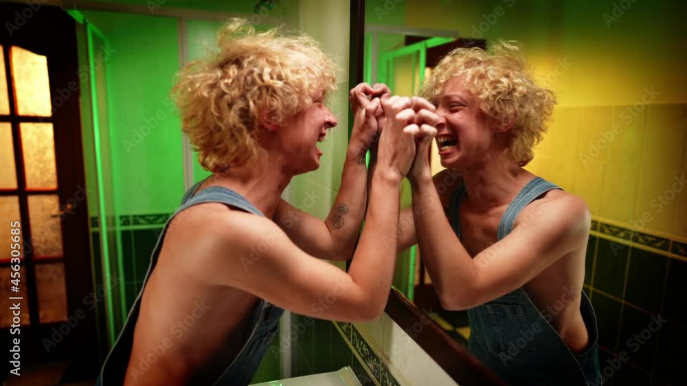 Vidéo Stock Side view of hopeless LGBT man screaming looking at ...