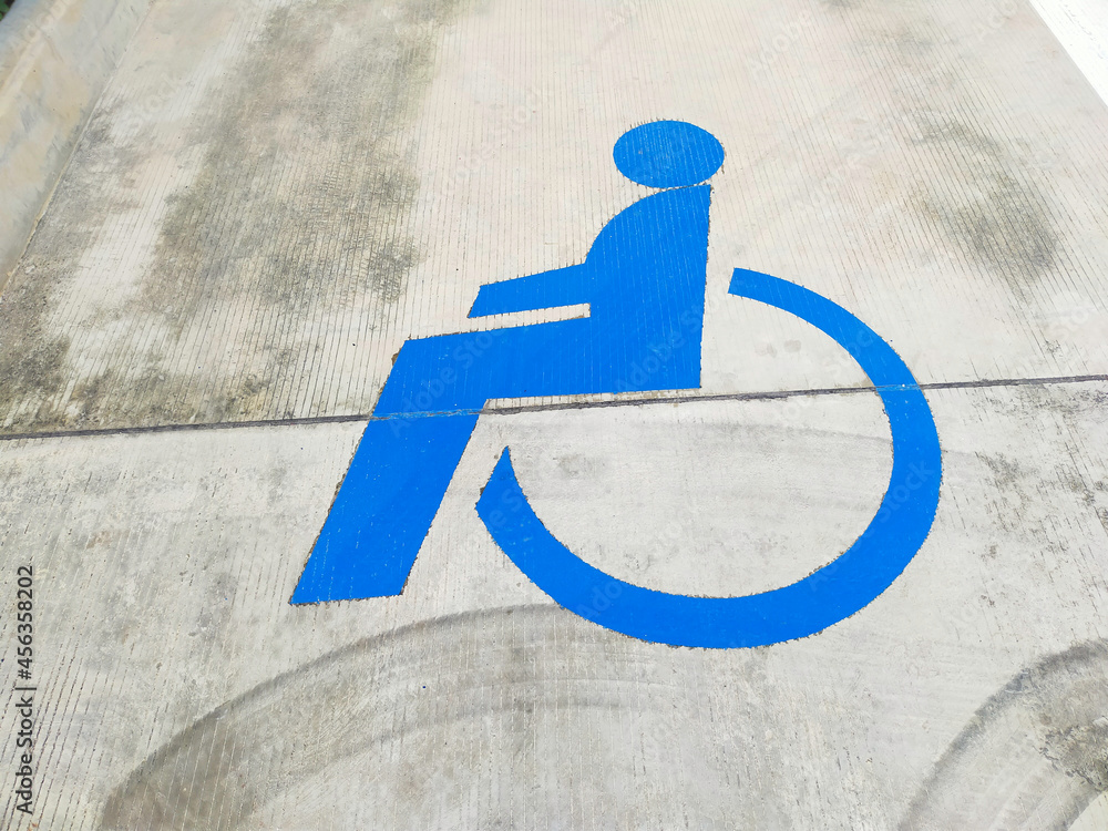 Handicap parking space in a parking lot. Handicapped parking spot ...