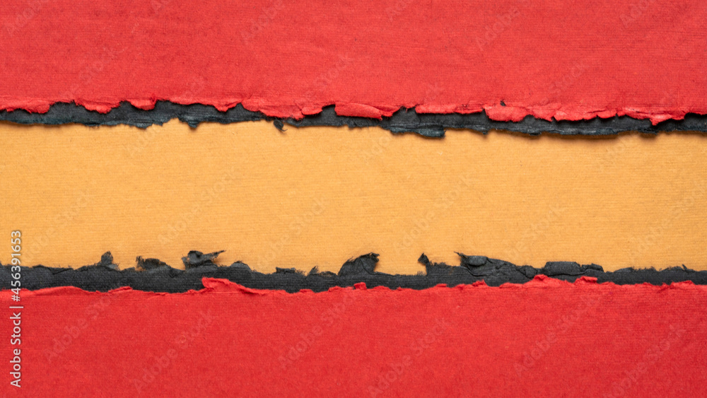 paper abstract in red, orange and black with a copy space - sheets of ...