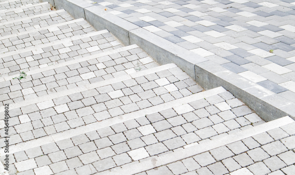Steps from paving slabs and curbs. Rows of gray steps made of gray ...