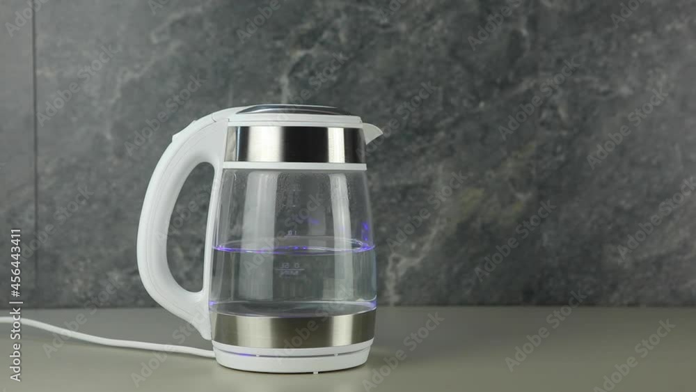 The water in the electric kettle is boiling. Boiling water for hot ...