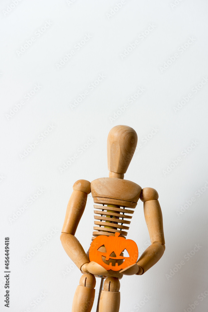 solitary manikin or mannikin poses with a flat jack o lantern Stock ...