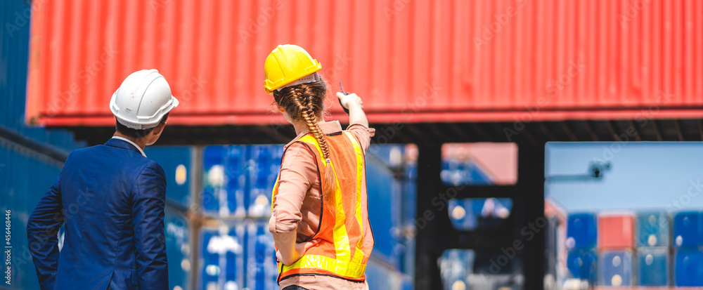 Professional of two engineer container cargo foreman in helmets working ...