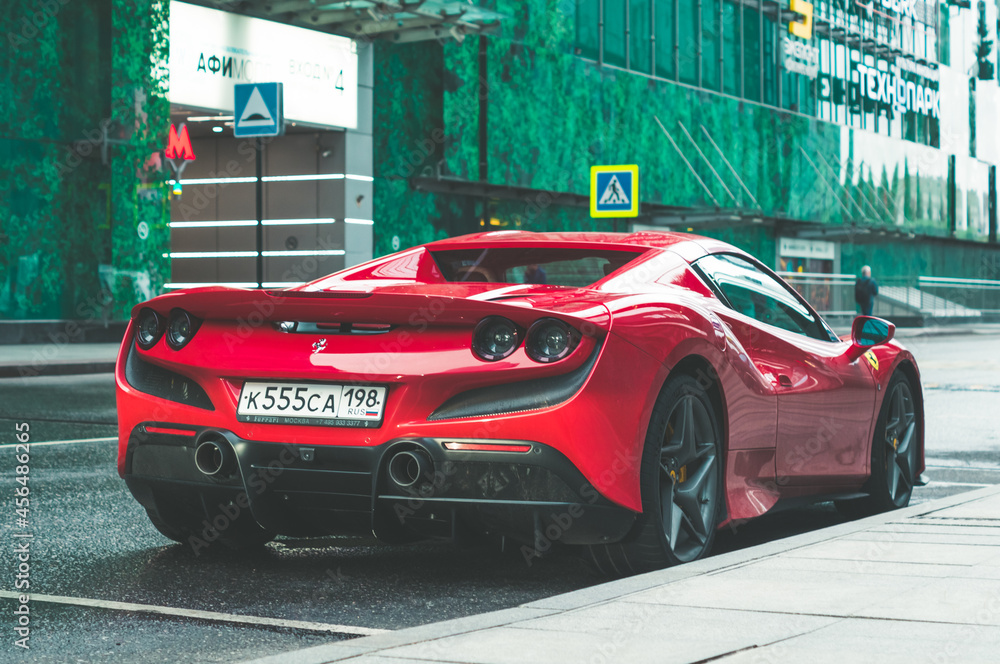 Foto de Red Ferrari F8 Spider parked on the street in Moscow. Supercar ...