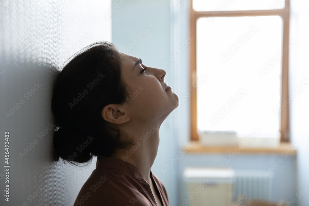Difficult life moment. Tired stressed indian woman sit leaning against ...