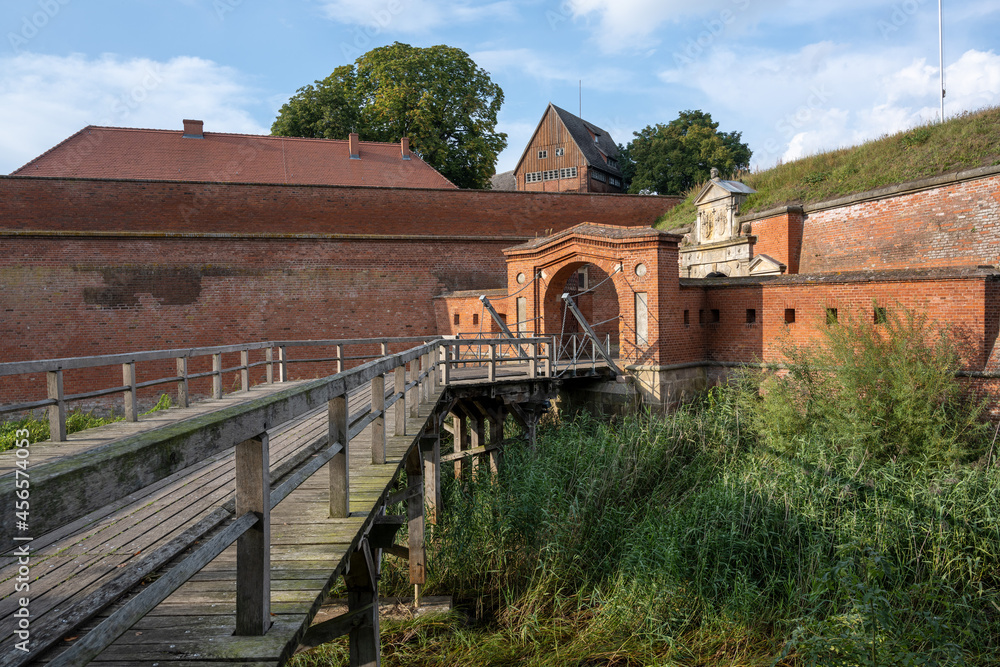 Wooden drawbridge at the entrance gate to the historic brick fortress ...