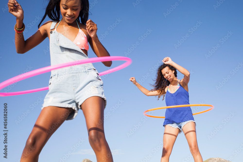 Women using hula hoop Stock Photo | Adobe Stock