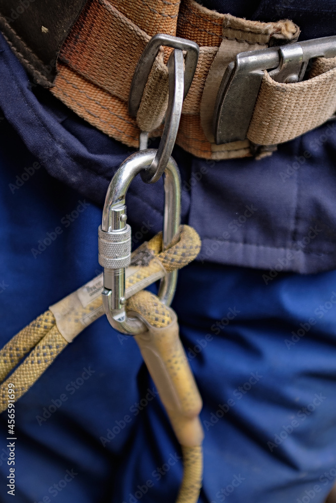 Man with safety equipment at work in the heights, safety body ...
