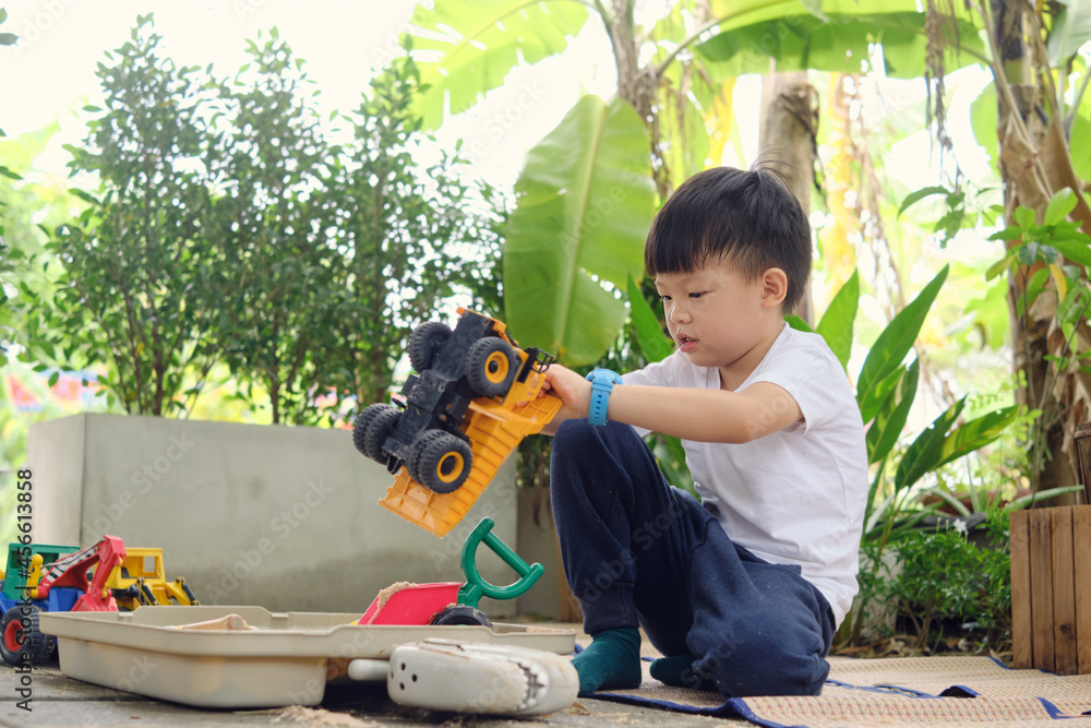 Cute Asian young kindergarten boy playing with sand alone at home, Kid ...