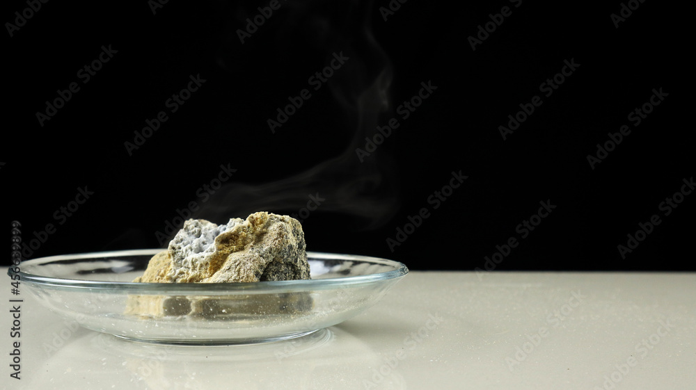 Calcium carbide or CaC2 reacts on contact with water and produces ...