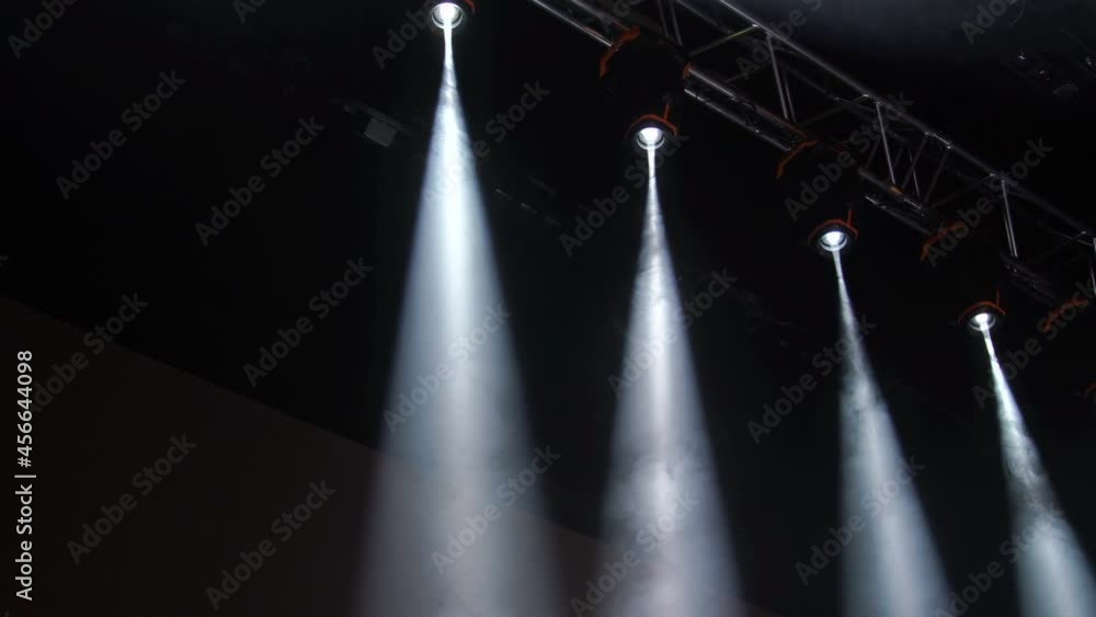 Four white projectors on the stage lights farm. Bright shiny stage ...