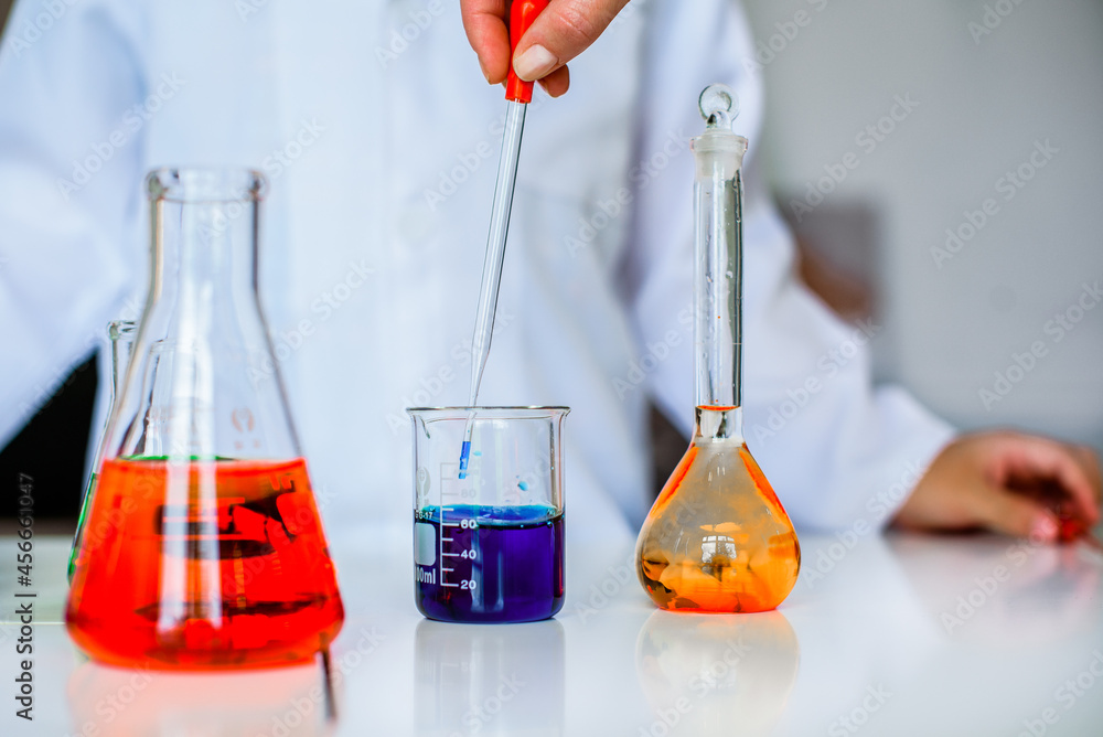 Chemistry laboratory. Conducting a chemical experiment. Experiments in ...