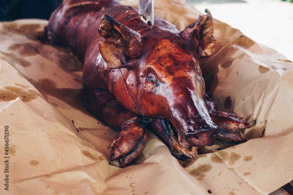 Head shot of the newly delivered and opened crispy Lechon AKA slowly ...