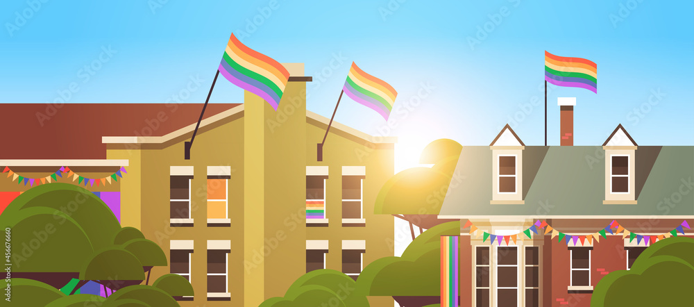 house facade decorated with LGBT rainbow flags lesbian gay parade ...