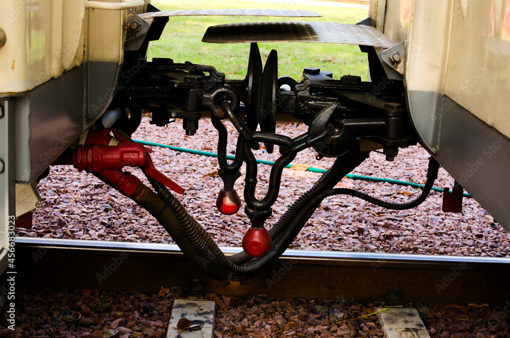 Close up detail of iron connection of two train wagons. Railway car ...