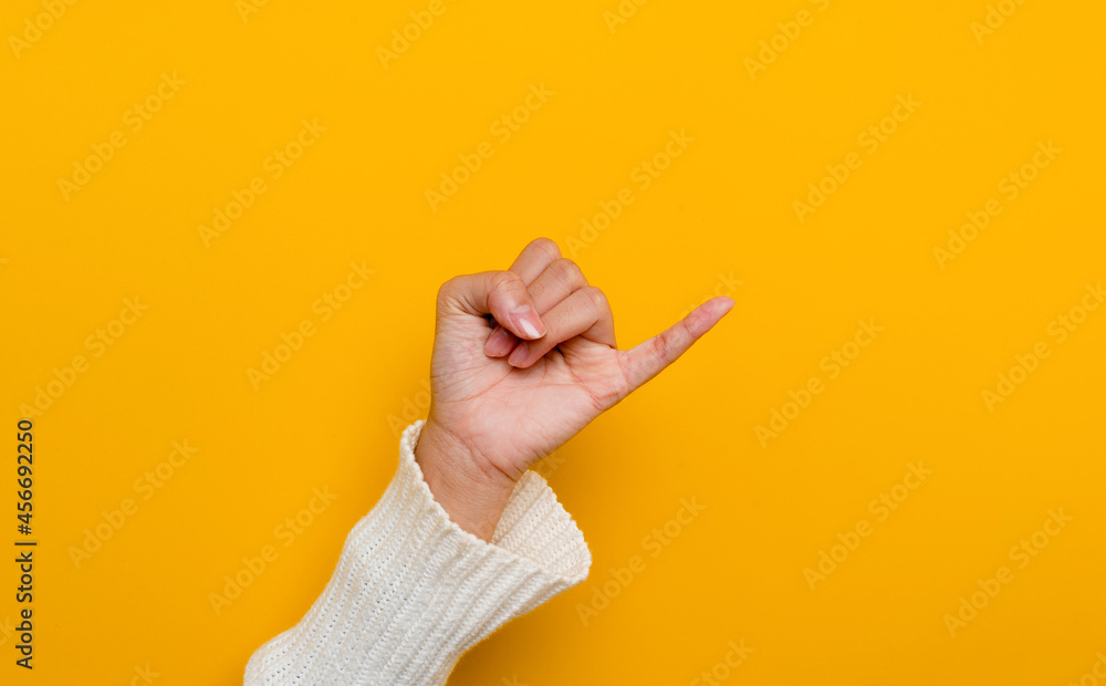 The promise of a white Asian woman's hand little finger split on yellow ...