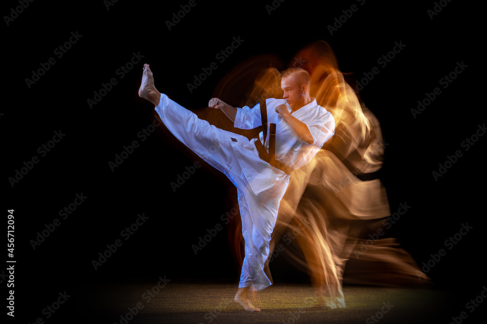 Full-length studio shot of young professional sportsman practising ...