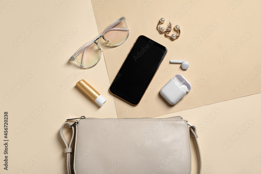 Flat lay composition with stylish woman's bag on color background Stock ...