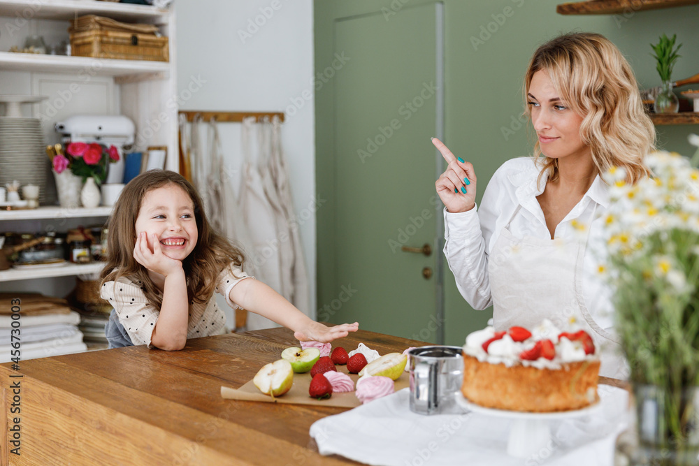 Strict chef cook baker mom woman in white shirt work don't allow child ...