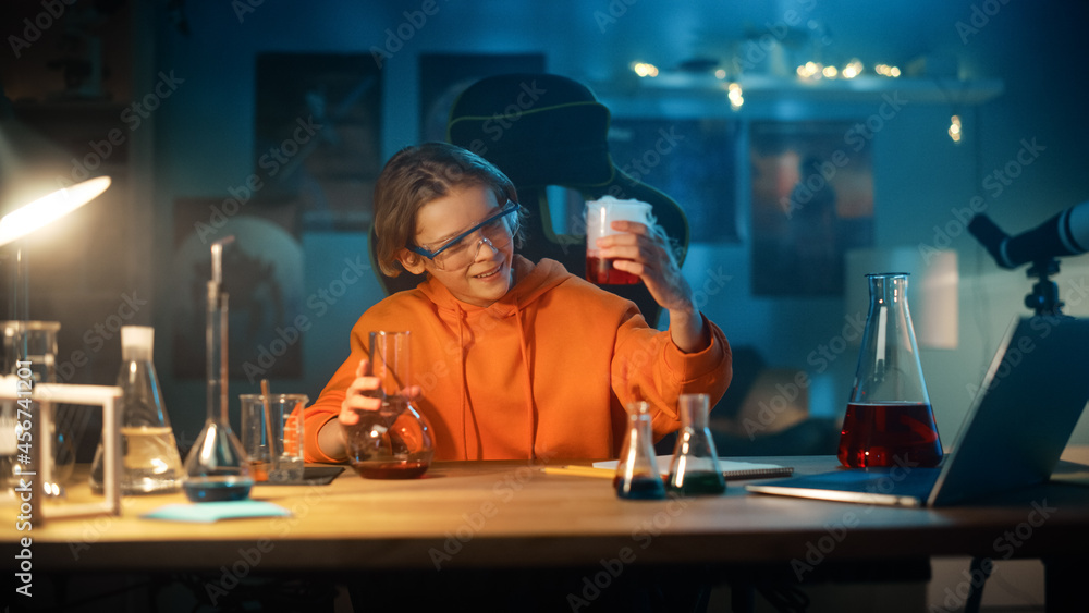 Smart Young Boy in Safety Goggles Mixes Colorful Chemicals in Beakers ...