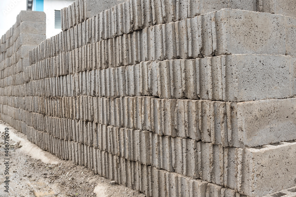 CHB or concrete hollow blocks stacked on top of each other at a ...