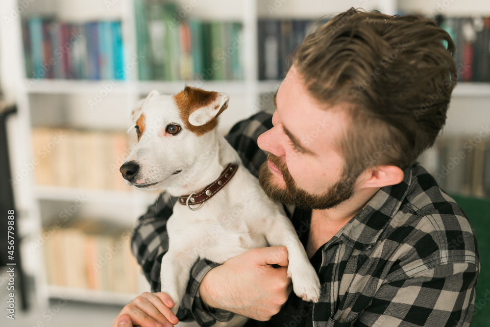 Happy male owner of jack russell terrier dog, feels responsibility of ...
