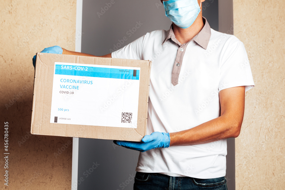 delivery medical box of vaccines. the courier delivers the vaccine ...