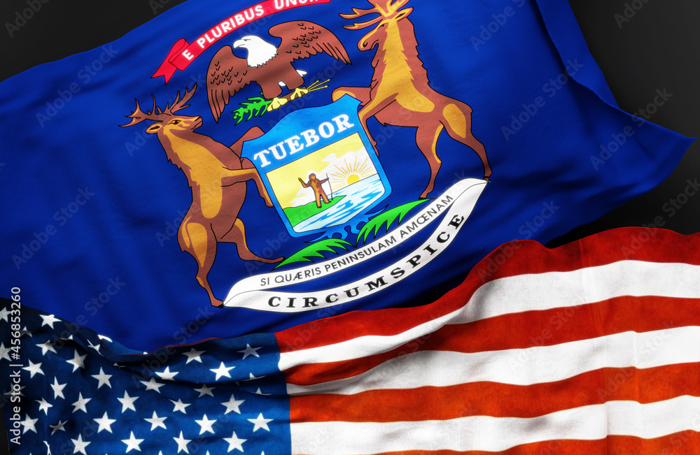 Flag of Michigan along with a flag of the United States of America as a ...