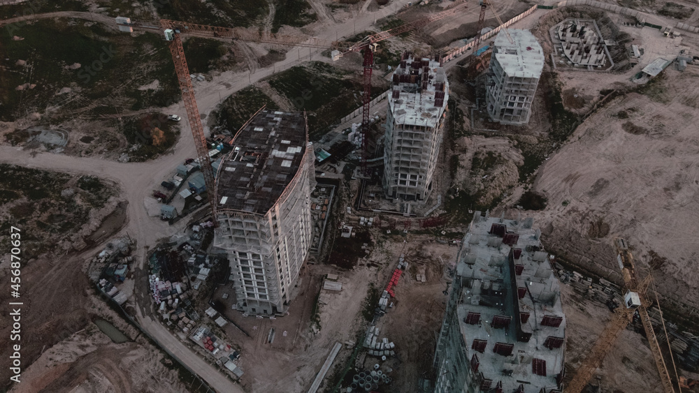 Construction site of a modern city block. High-rise buildings under ...