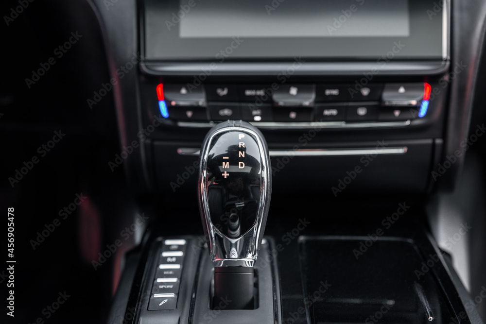 Detail of an automatic gear shifter in a new, modern car. Cockpit ...