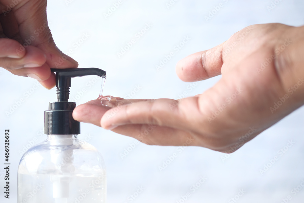 Using sanitizer liquid for preventing corona virus Stock Photo | Adobe ...